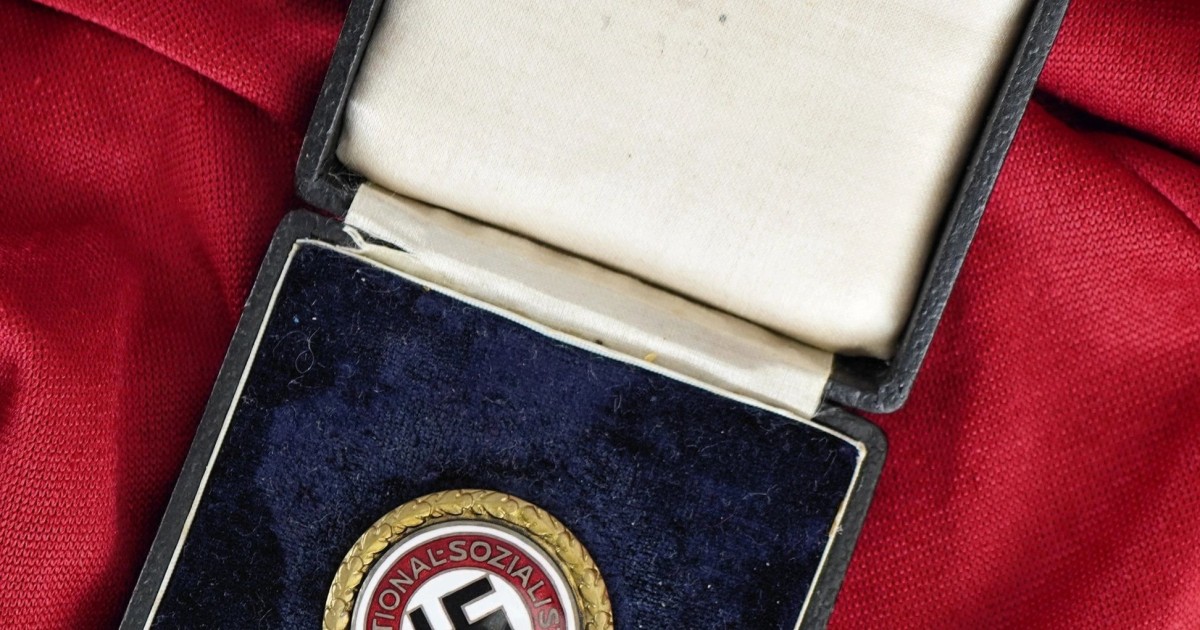 SOLD - Cased 30mm Gold Party Badge